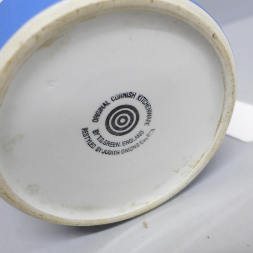 A T.G. Green 'milk' jug and one other jug and a Pyrex glass rolling pin