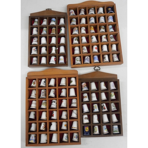 A large collection of thimbles with three display racks **PLEASE NOTE ...