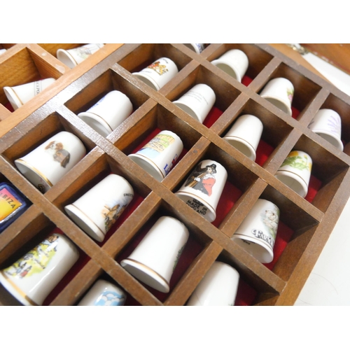 A large collection of thimbles with three display racks **PLEASE NOTE ...