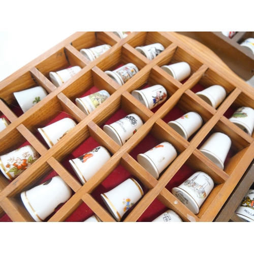 A large collection of thimbles with three display racks **PLEASE NOTE ...