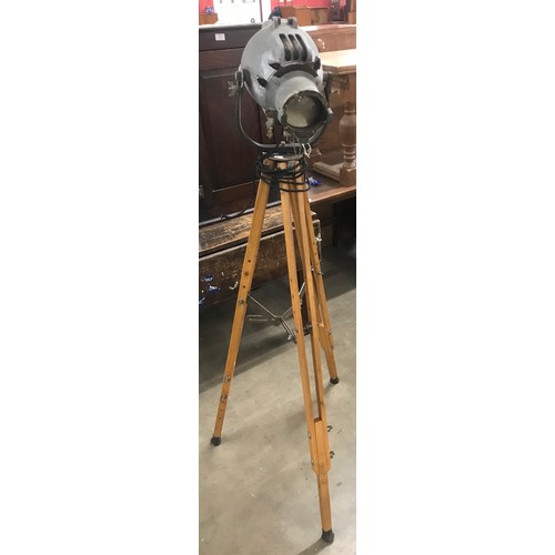 A vintage Strand Electric spotlight on tripod stand