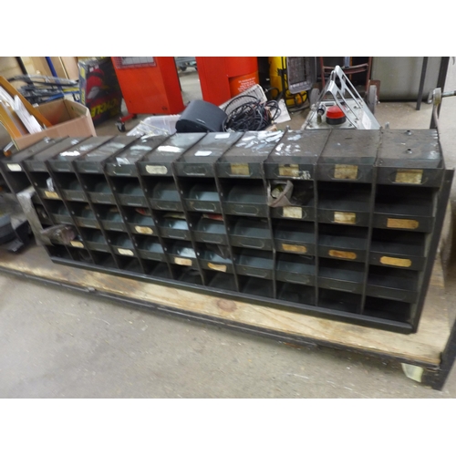 A vintage metal workshop pigeon hole rack