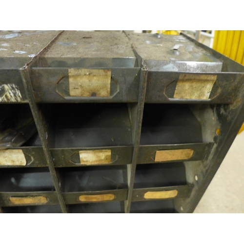 A vintage metal workshop pigeon hole rack