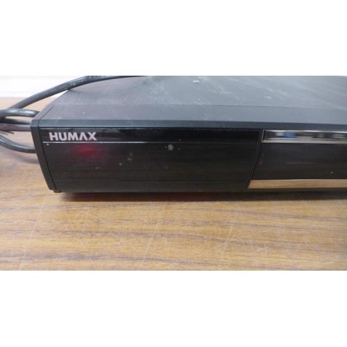 A Humax PVR-9300T Freeview box with remote