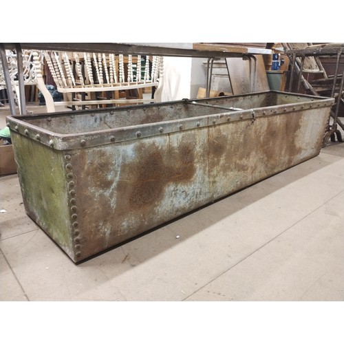 A large galvanised watering trough