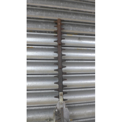 A Ryobi Powr-LT2 petrol driven strimmer and a Mito-X petrol driven long ...