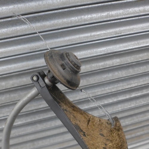 A Ryobi Powr-LT2 petrol driven strimmer and a Mito-X petrol driven long ...