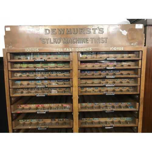 A Dewhurst's Sylko Machine Twist beech and walnut haberdashery shop cabinet