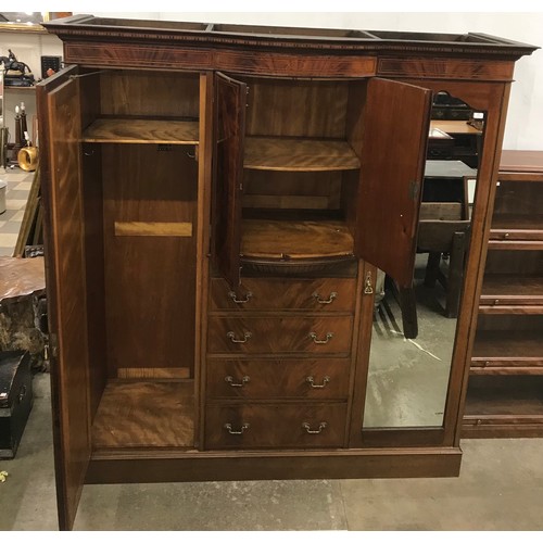 An Edward VII inlaid mahogany combination wardrobe