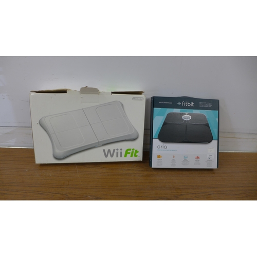 A Nintendo Wii Fit Balance Board and FitBit Aria wi-fi Smart Scales