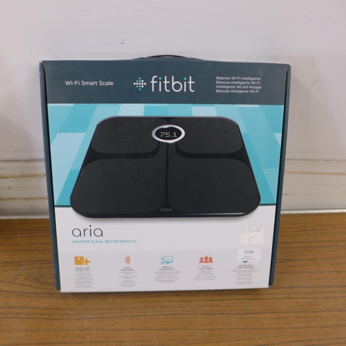 A Nintendo Wii Fit Balance Board and FitBit Aria wi-fi Smart Scales