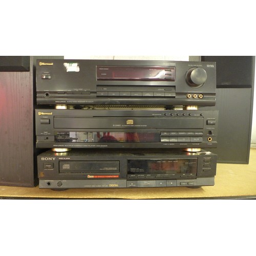 A quantity of stereo equipment including a Sherwood RV-4050R audio/video receiver, a Sherwood CDC-50