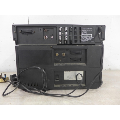 An Amstrad double decker VHS player and Hitachi VHS player