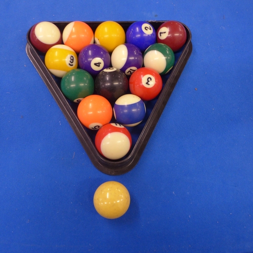 A BCE blue felt pool table with full set of balls, triangle and cues