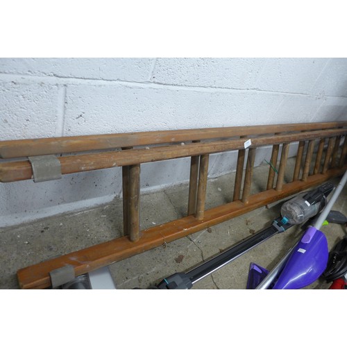 A set of double 13 rung wooden step ladders
