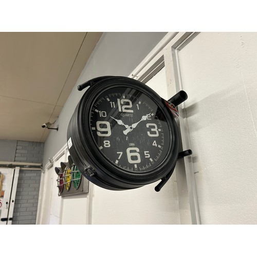 A double sided platform clock