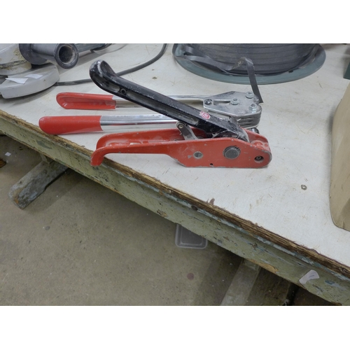 A banding machine with a box of metal clips