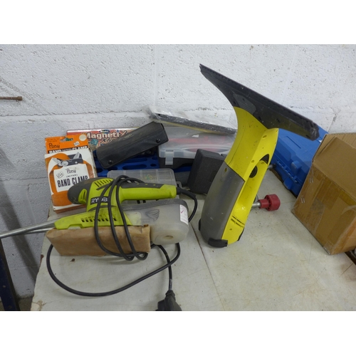 A box of assorted items including Karcher WV50 window cleaner, Ryobi ...
