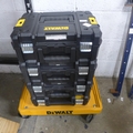 A set of 4 stacking DeWalt toolboxes on DeWalt dolly wheels