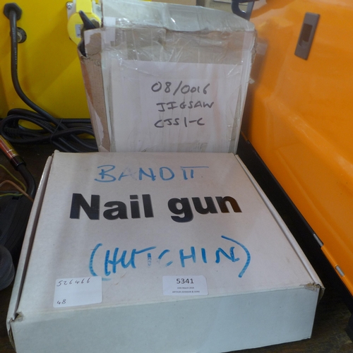A boxed sample Clarke Air Bandit and nail gun with a quantity of nails ...