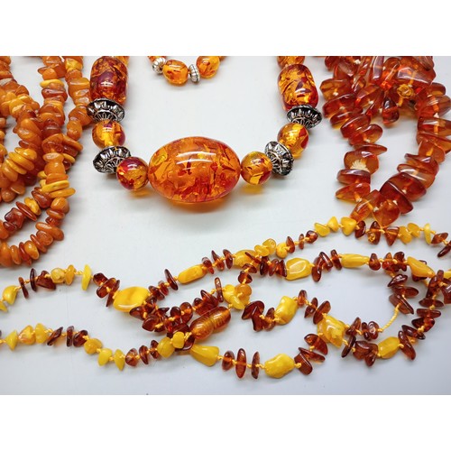 Five strings of amber/amber style necklaces