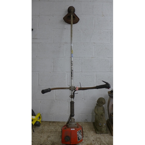 A Homelite HBL-38, 40cc petrol strimmer