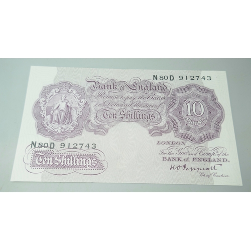 English bank notes - a pair of Britannia notes, mauve issue 1940s ...