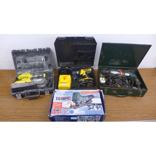 A large assortment of power tools including Black and Decker, Titan ...