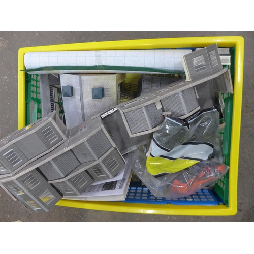 A model railway station with decorative back drop and 2 boxes of ...