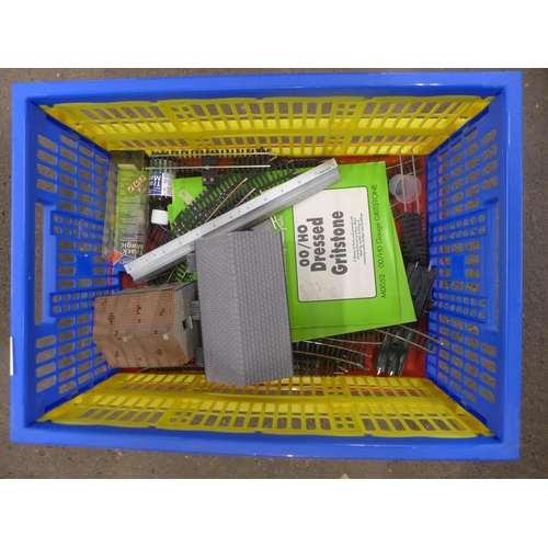 A model railway station with decorative back drop and 2 boxes of ...