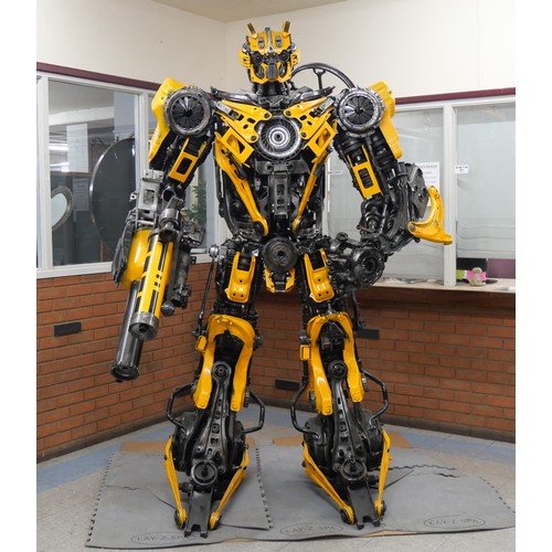An approximately 8ft tall, hand welded life-size sculpture of Bumblebee ...