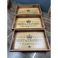 A Set of three 'Moët' champagne trays