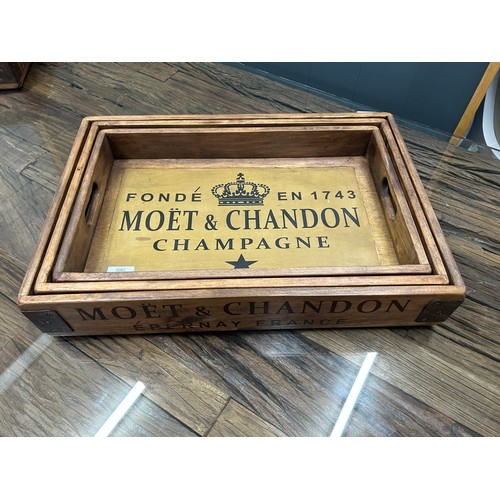 A Set of three 'Moët' champagne trays