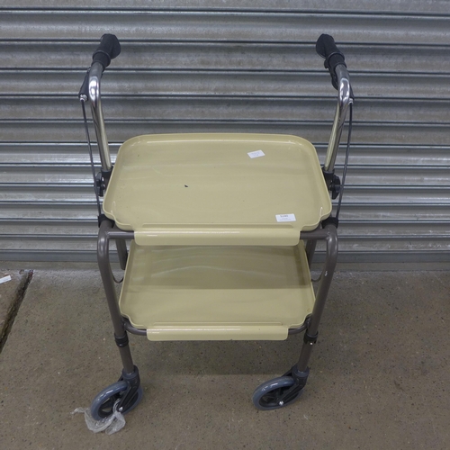 An Aidapt height adjustable kitchen strolley trolley with brakes