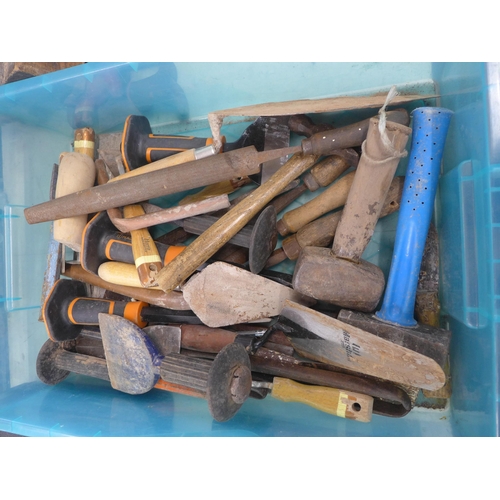 A large quantity of hand tools including trowels, bolster chisels ...