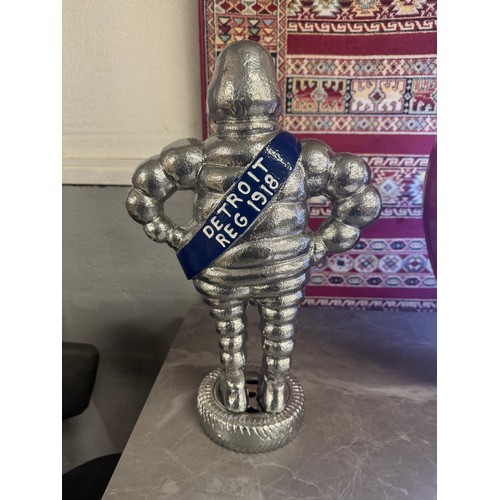 A silver effect Michelin man ornament