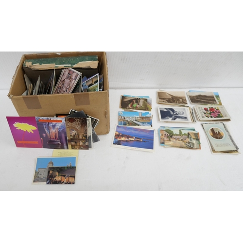 Postcards; a large collection of postcards in album and loose