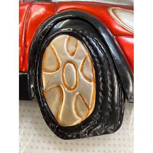 Two large tin-plate wall plaques, Mini Cooper and a motorcycle