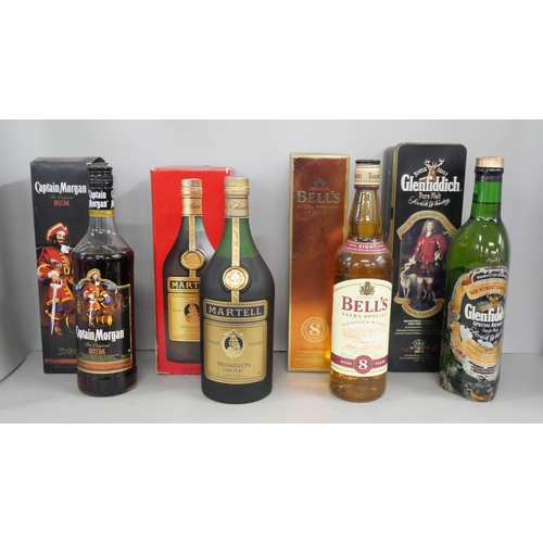 Collection of four boxed alcohol bottles to include Captain Morgan Rum ...