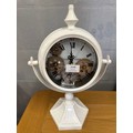 A white mantel clock