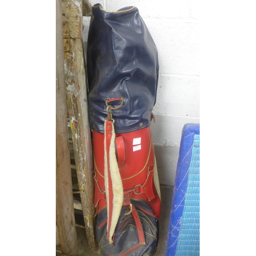 A golf bag and various golf clubs including Fore black ridge series 3 ...