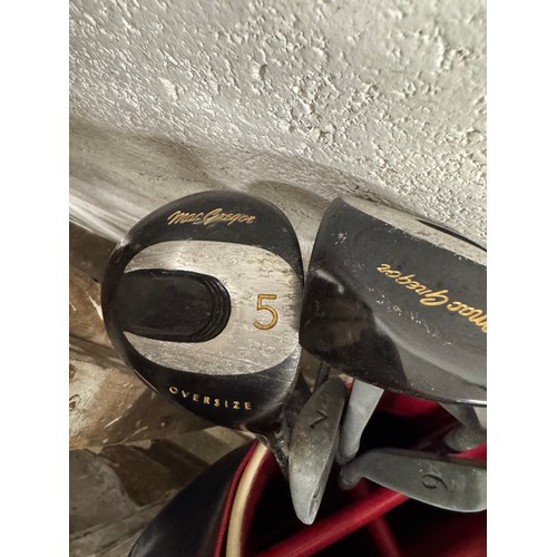A golf bag and various golf clubs including Fore black ridge series 3 ...
