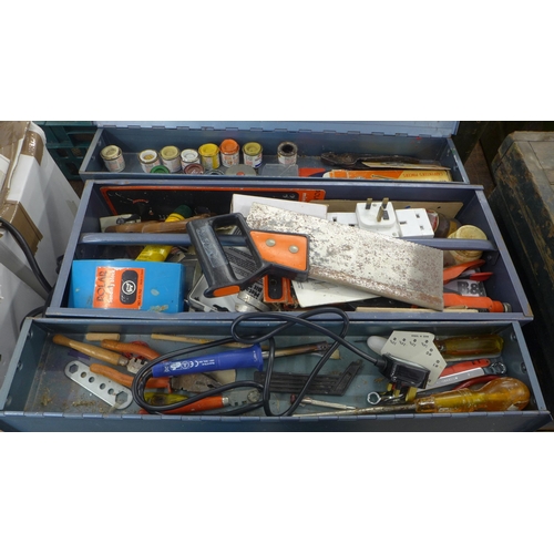 A tool box with a quantity of tools including a tabletop vice, a ...