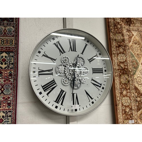 A circular moving gears clock