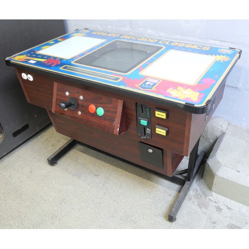 A Retro Arcade Classics glass topped cocktail table arcade machine