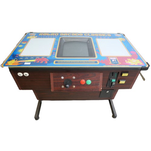 A Retro Arcade Classics glass topped cocktail table arcade machine