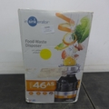 An Insinkerator foot waste disposer model 46AS, boxed, unused