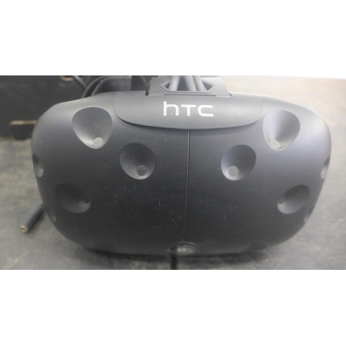 A HTC Vive Virtual Reality headset kit powered by steam V.R.