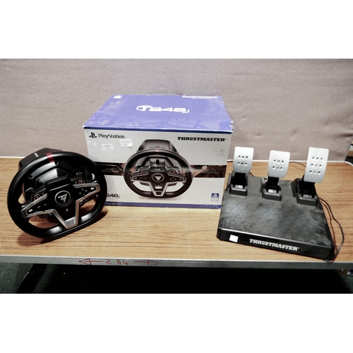 Thrustmaster PlayStation steering wheel and pedals *This lot is subject ...