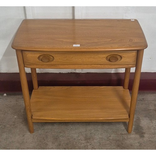 An Ercol Blonde ash single drawer Windsor hall table